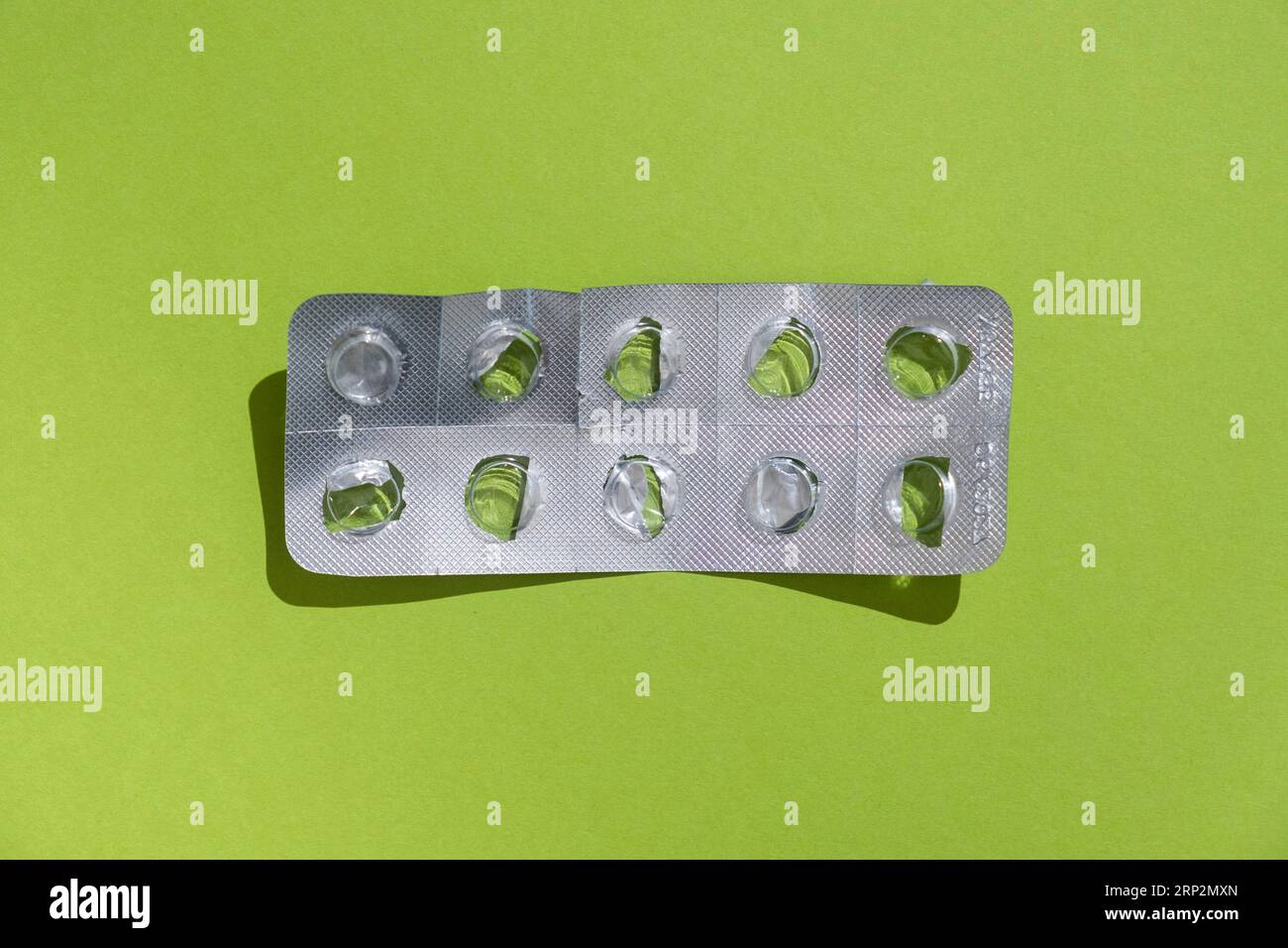 Empty tablet blister pack against a monochrome background, top view ...