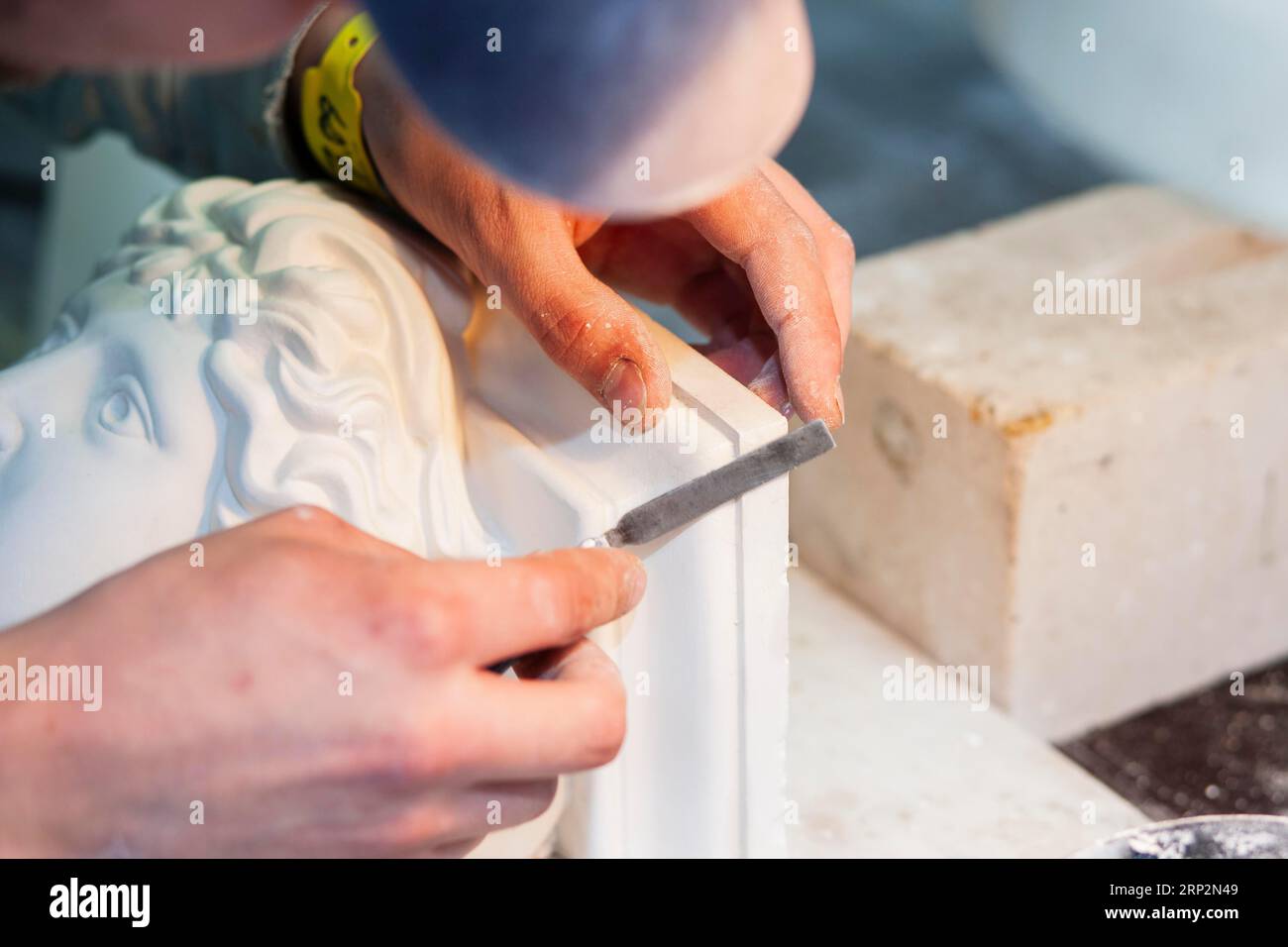 A plasterer restores a stucco figure Stock Photo - Alamy