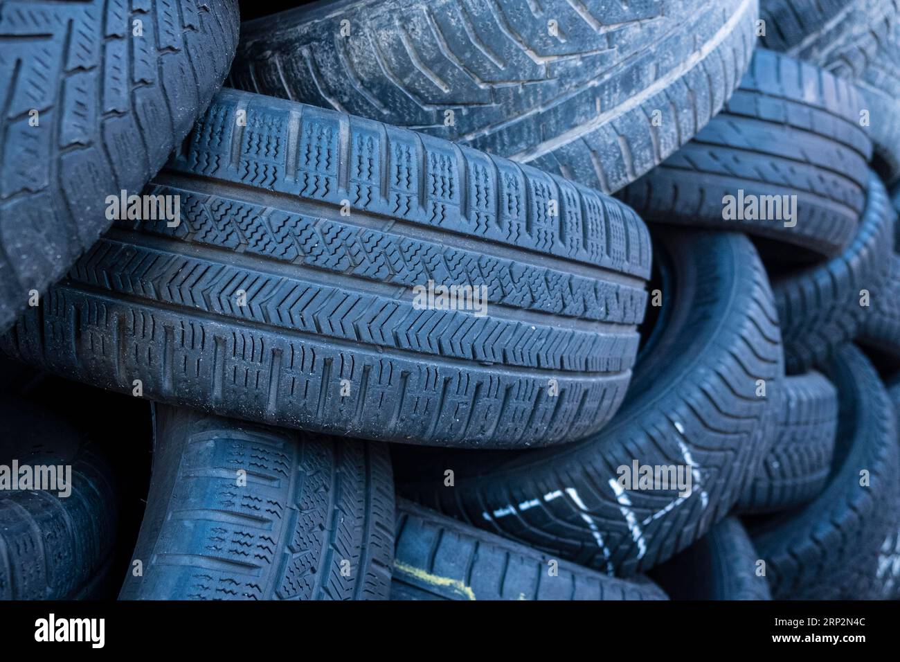 Pile of worn old tyres from passenger cars Stock Photo - Alamy