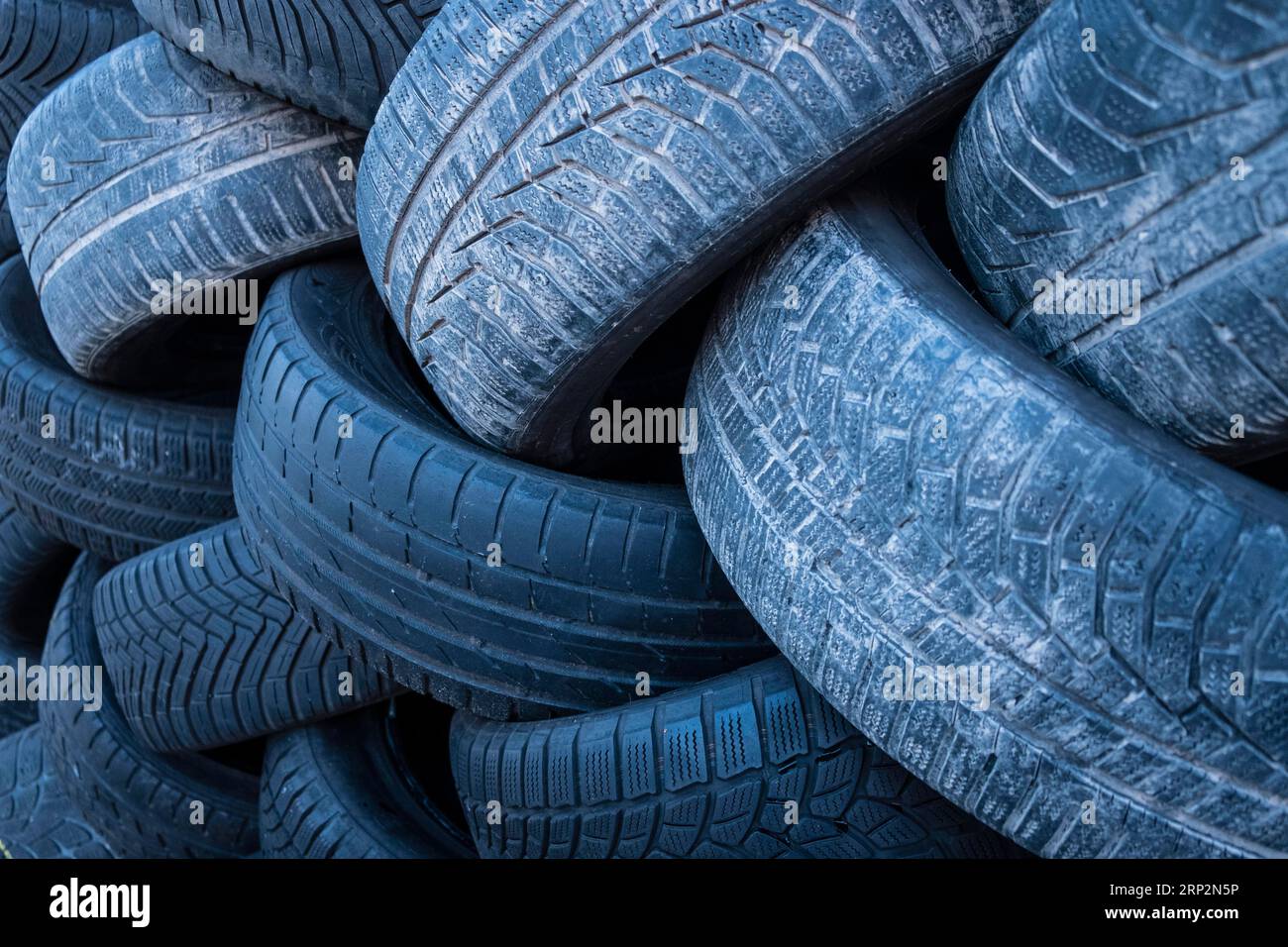 Pile of worn old tyres from passenger cars Stock Photo - Alamy
