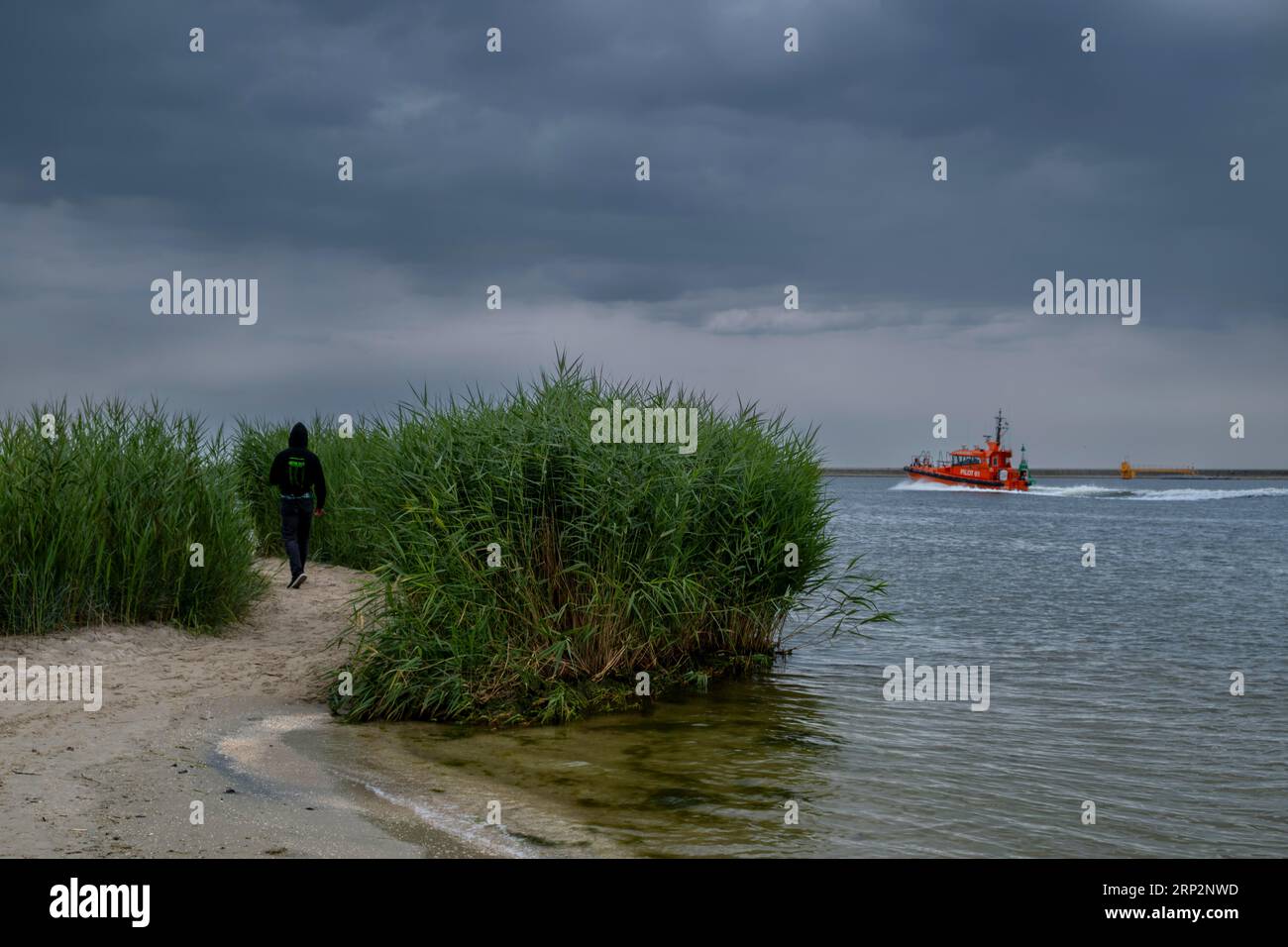 Poland, Swinoujscie, 23.07.2023, mouth of the Swine, boat, ship, person ...