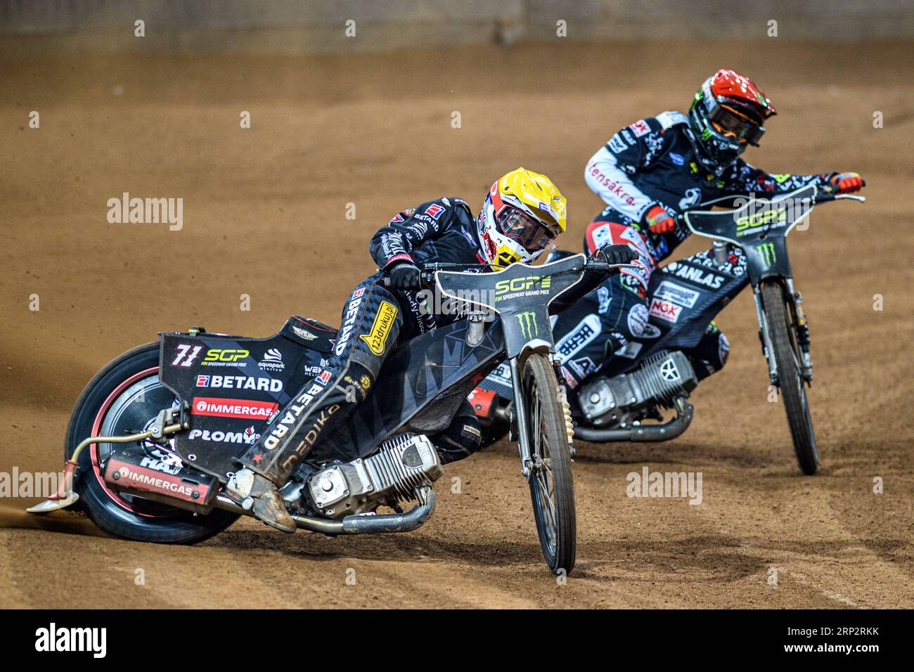 Maciej Janowski (71) (Yellow) leads Freddie Lindgren (66) (Red) during ...