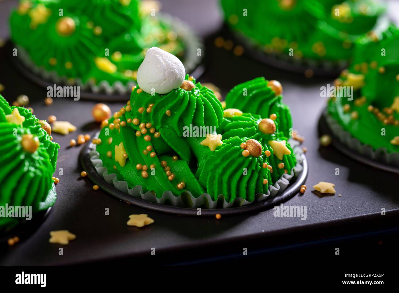 Delicious green cupcakes with green flower shaped cream. Unique dessert ...