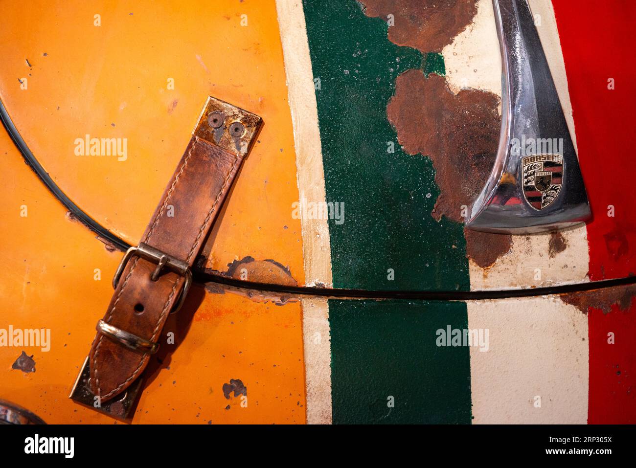 Leather hood or bonnet strap detail and emblem on orange Porsche 356 C ...
