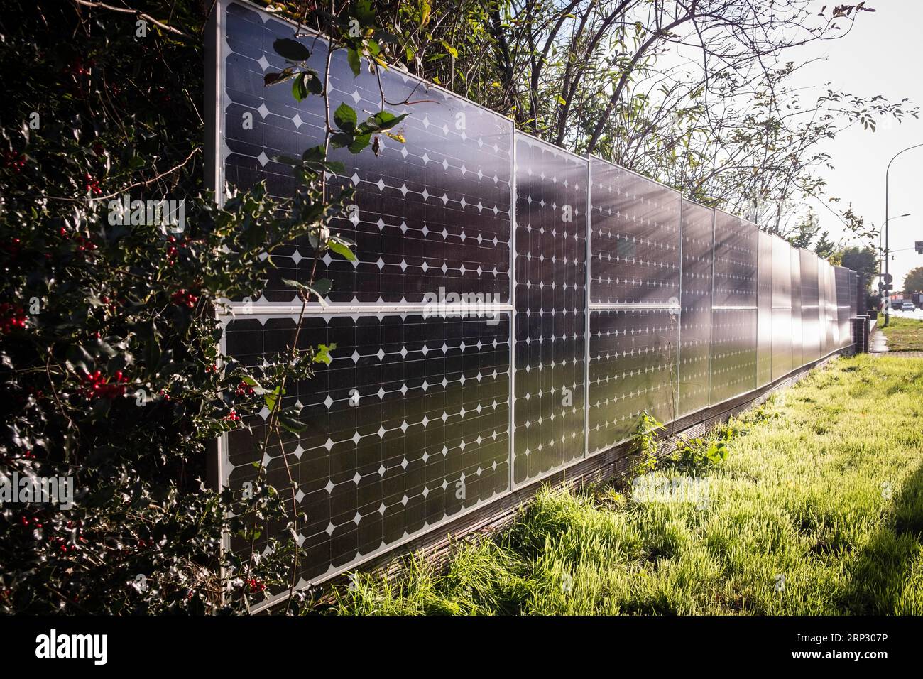 Solar panels as a garden fence and privacy screen of a house on a ...
