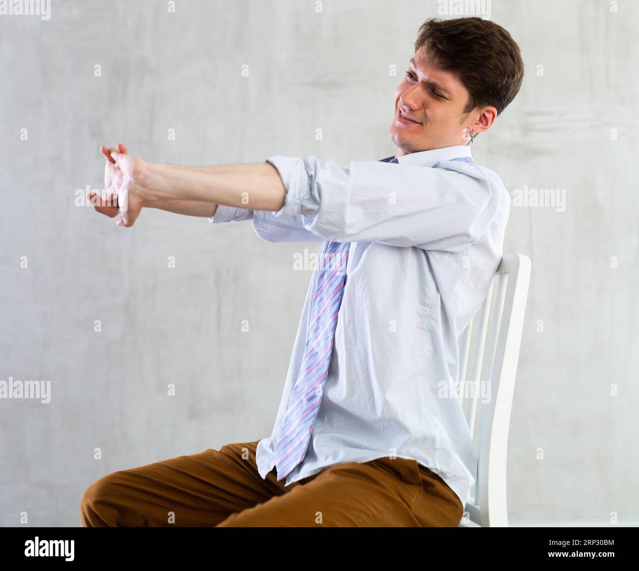 Physical jerks for office workers on chair Stock Photo - Alamy