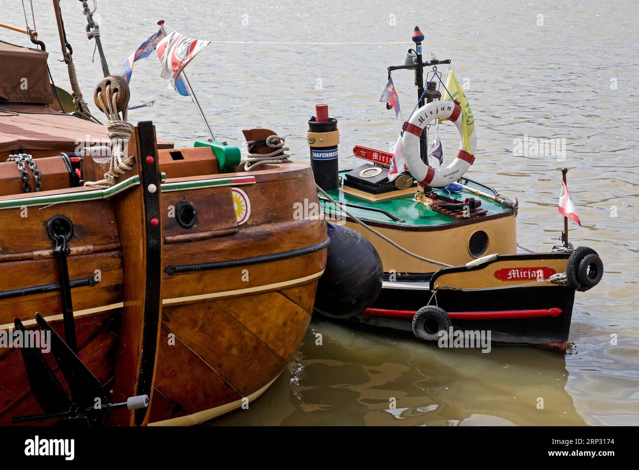 Small ship Mirjan next to the large historic sailing ship Mutte Altje ...