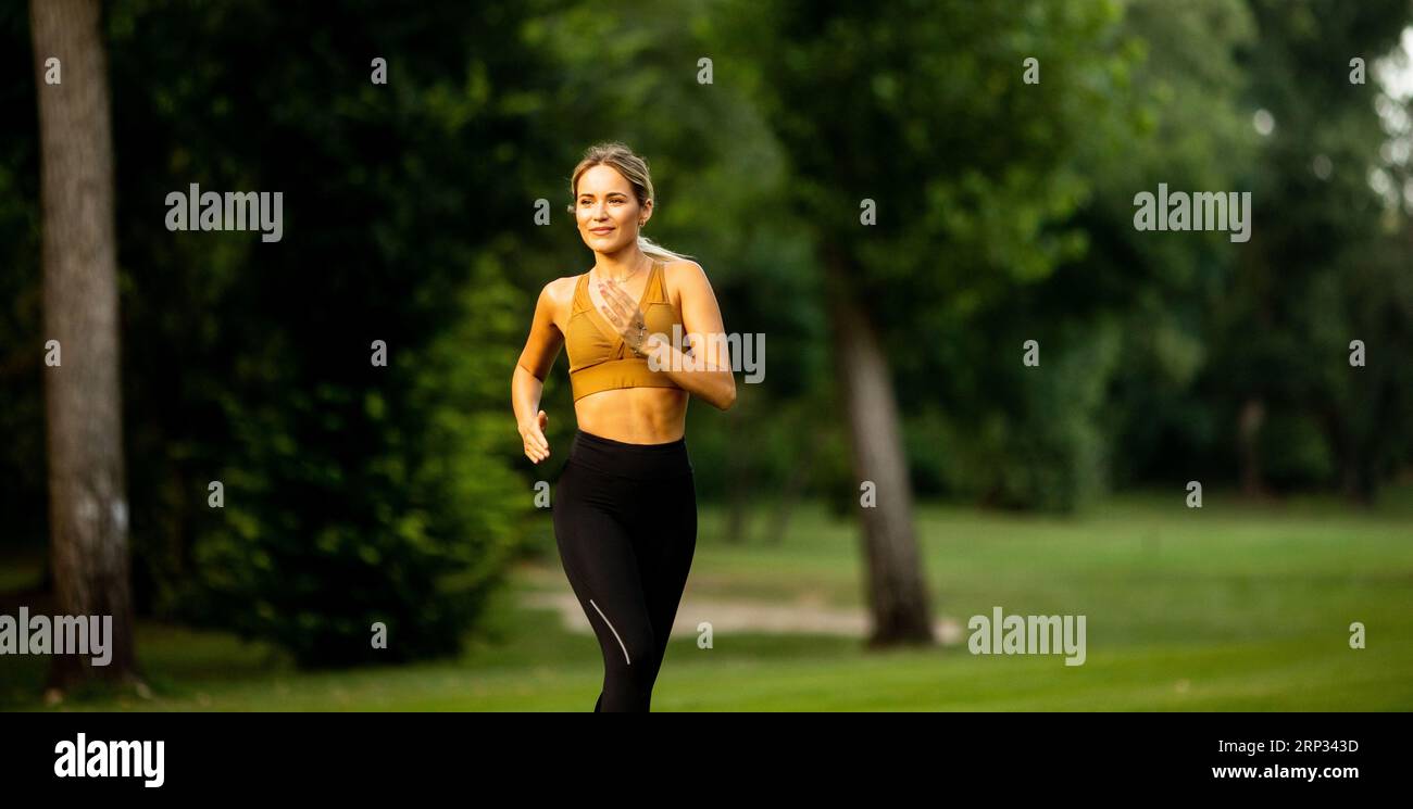 Attractive young woman running hi-res stock photography and images - Alamy