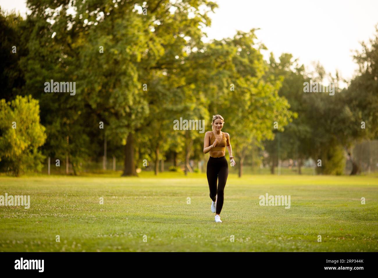 Attractive young woman jogger hi-res stock photography and images - Alamy