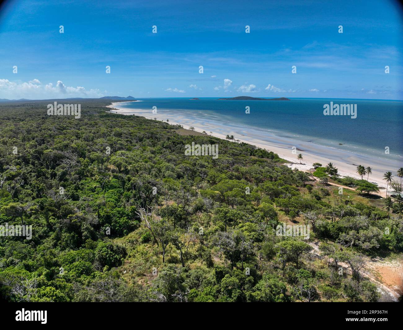 Aerial view of white rippling sandy beach and blue clear water in ...