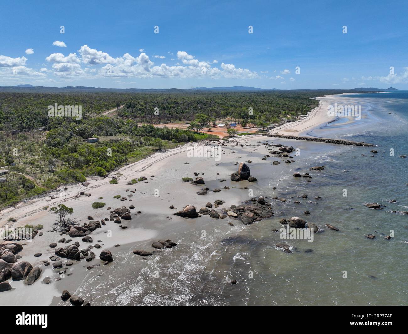 Aerial view of white rippling sandy beach and blue clear water in ...