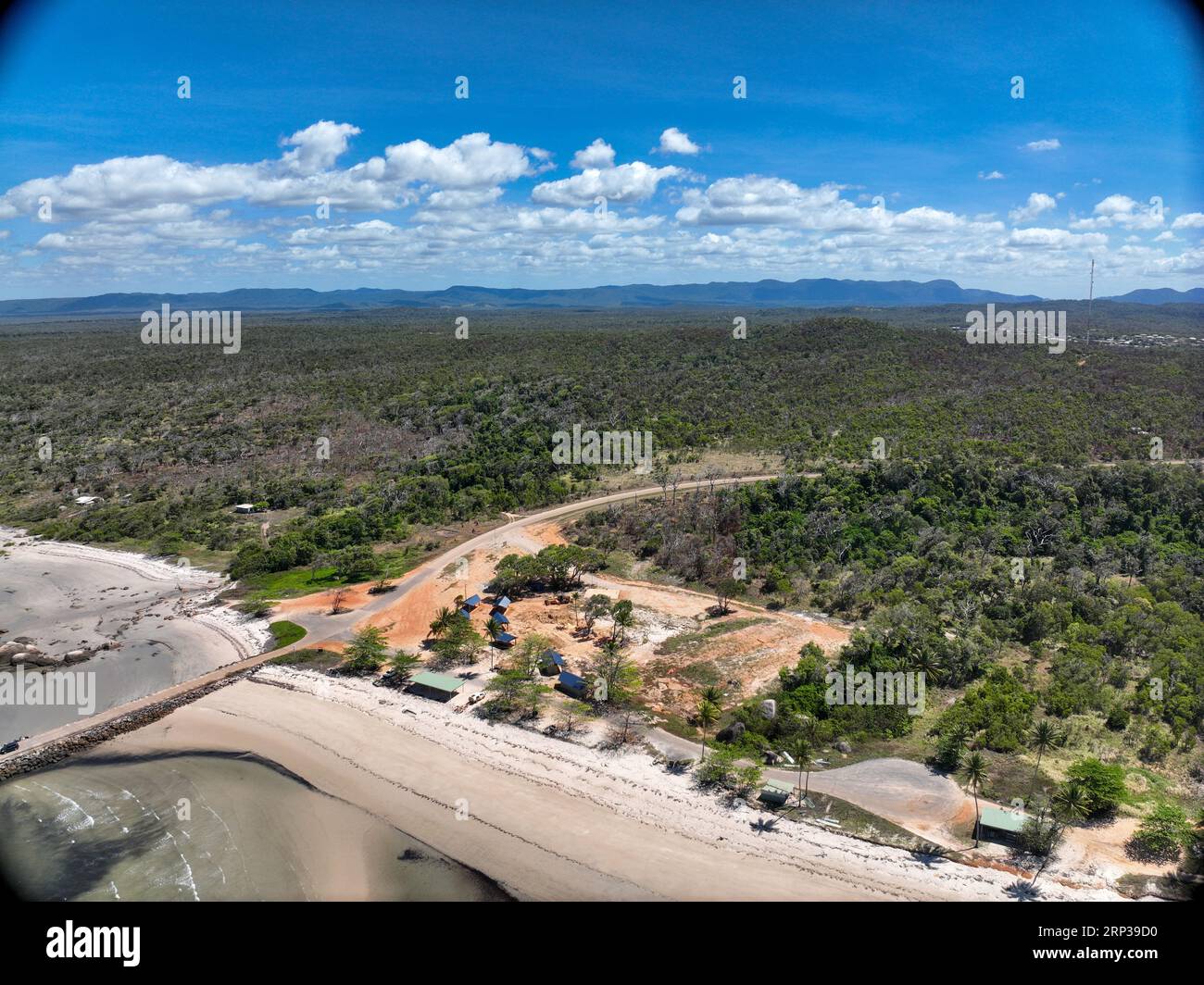 Aerial view of white rippling sandy beach and blue clear water in ...
