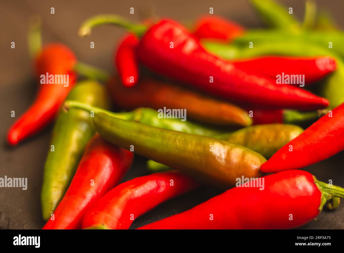 Red hot chilli peppers. Heap of red and green pepper. Bright natural ...