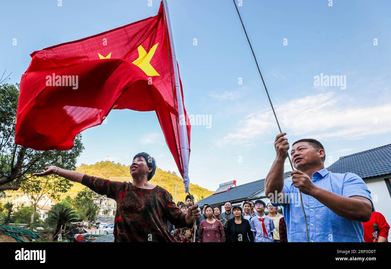 (181001) -- HUZHOU, Oct. 1, 2018 -- A flag raising ceremony is held at ...