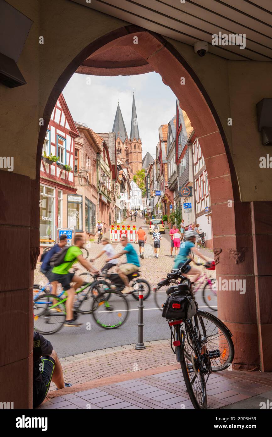 Gelnhausen, Germany. 03rd Sep, 2023. Cyclists ride past the historic ...