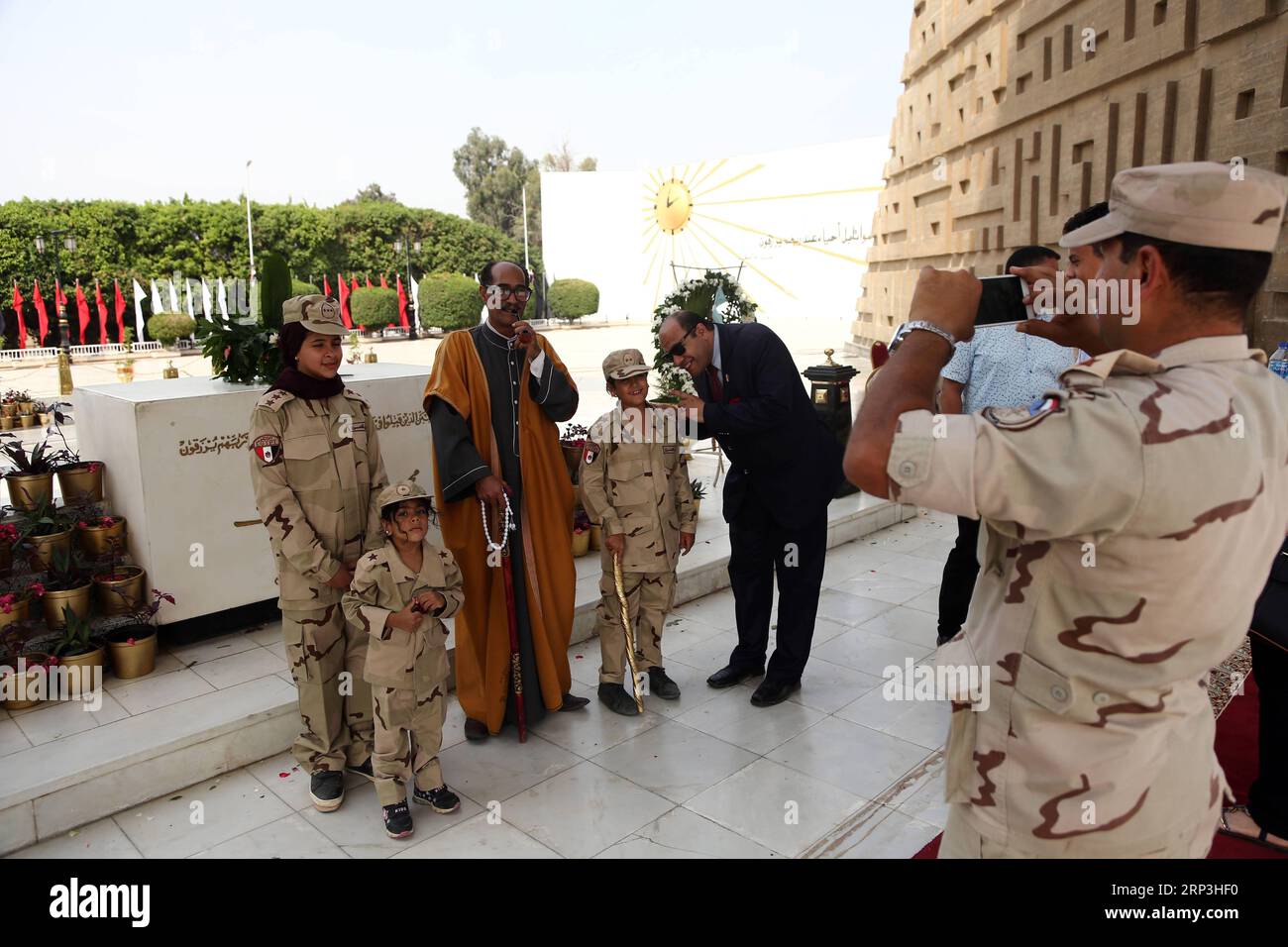 (181006) -- CAIRO, Oct. 6, 2018 -- People take photos at the Sadat ...