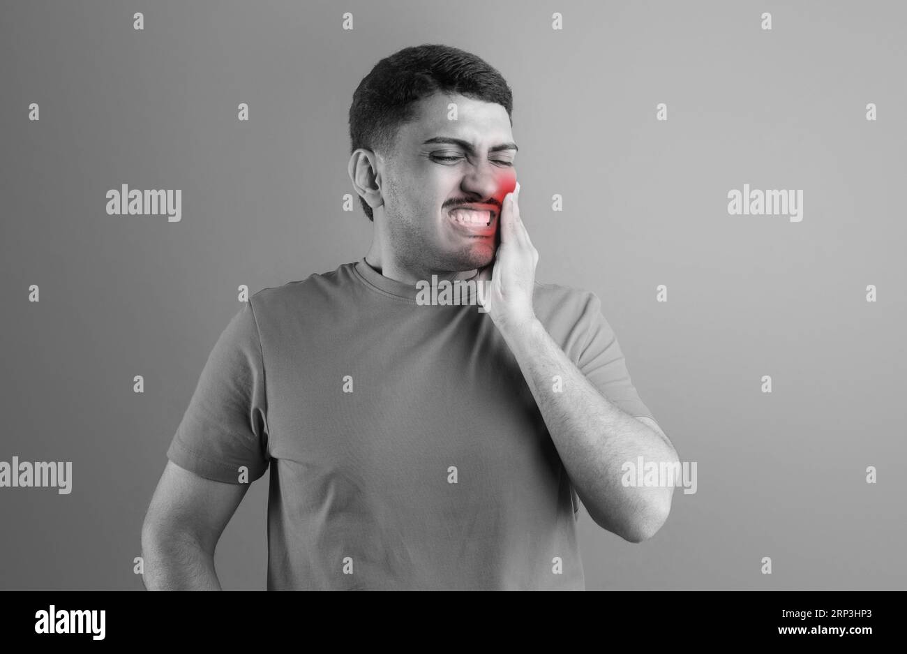 Teeth problem. Young man suffering acute toothache, touching aching red ...