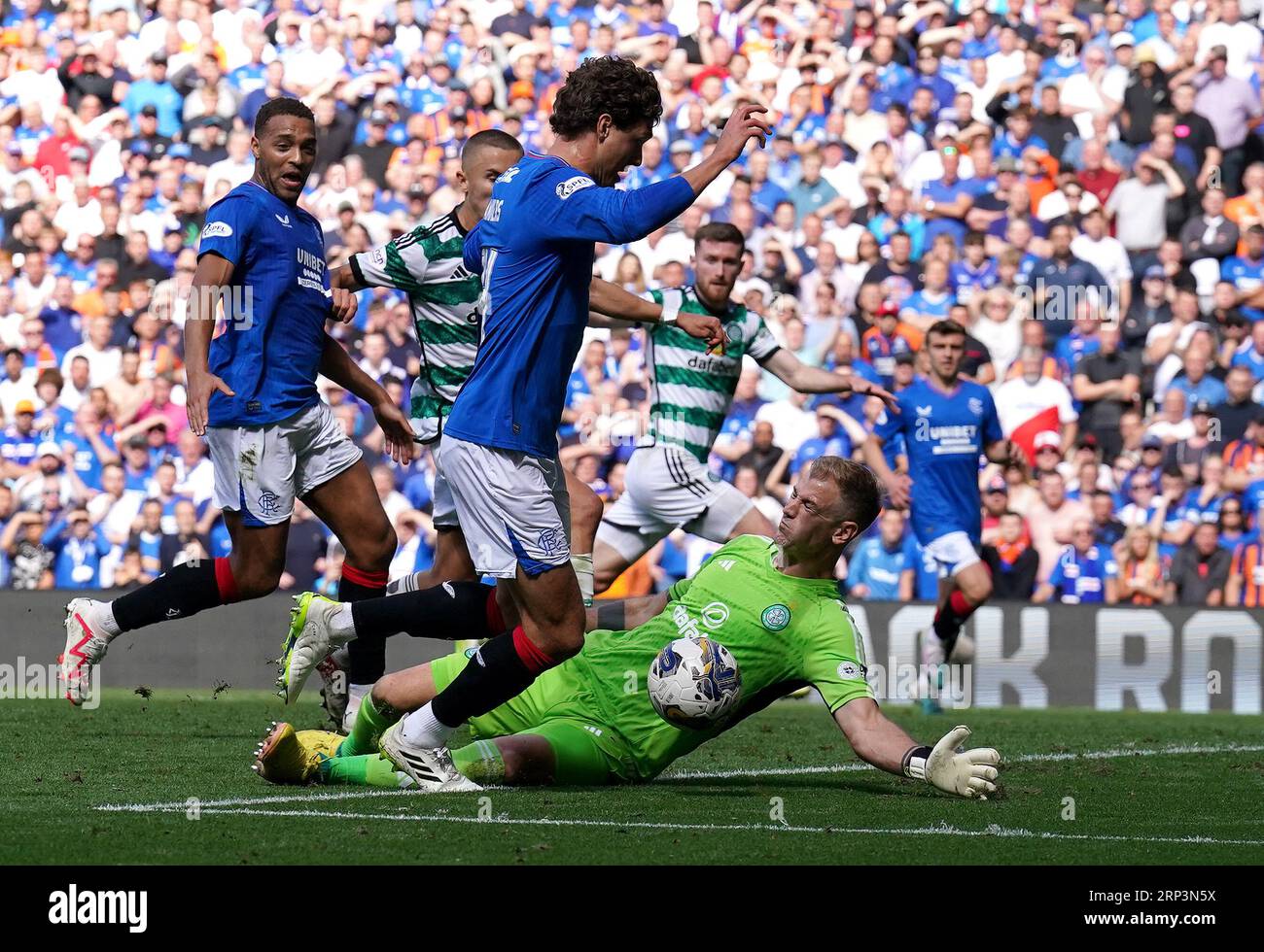 Rangers' Sam Lammers goes around Celtic goalkeeper Joe Hart before ...