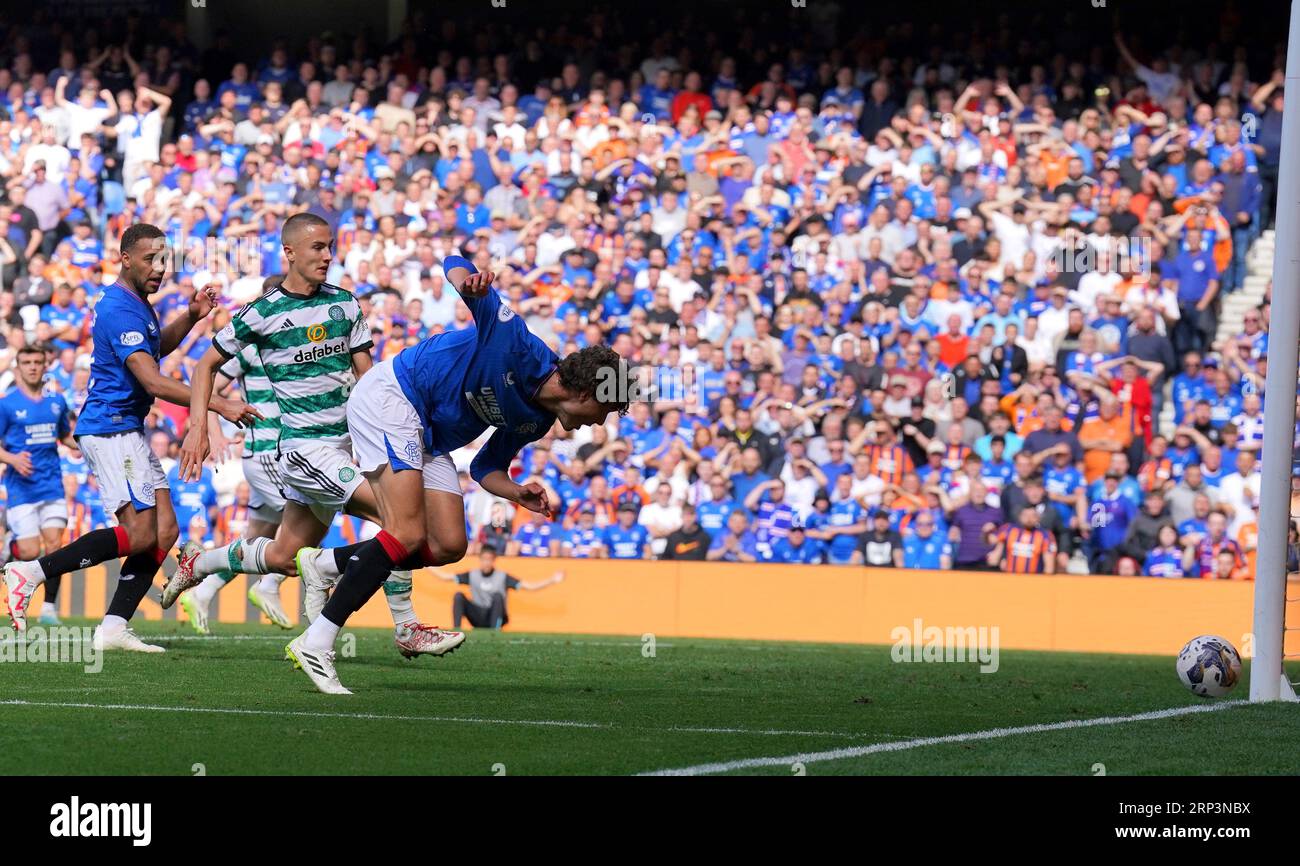 Rangers' Sam Lammers goes around Celtic goalkeeper Joe Hart before ...