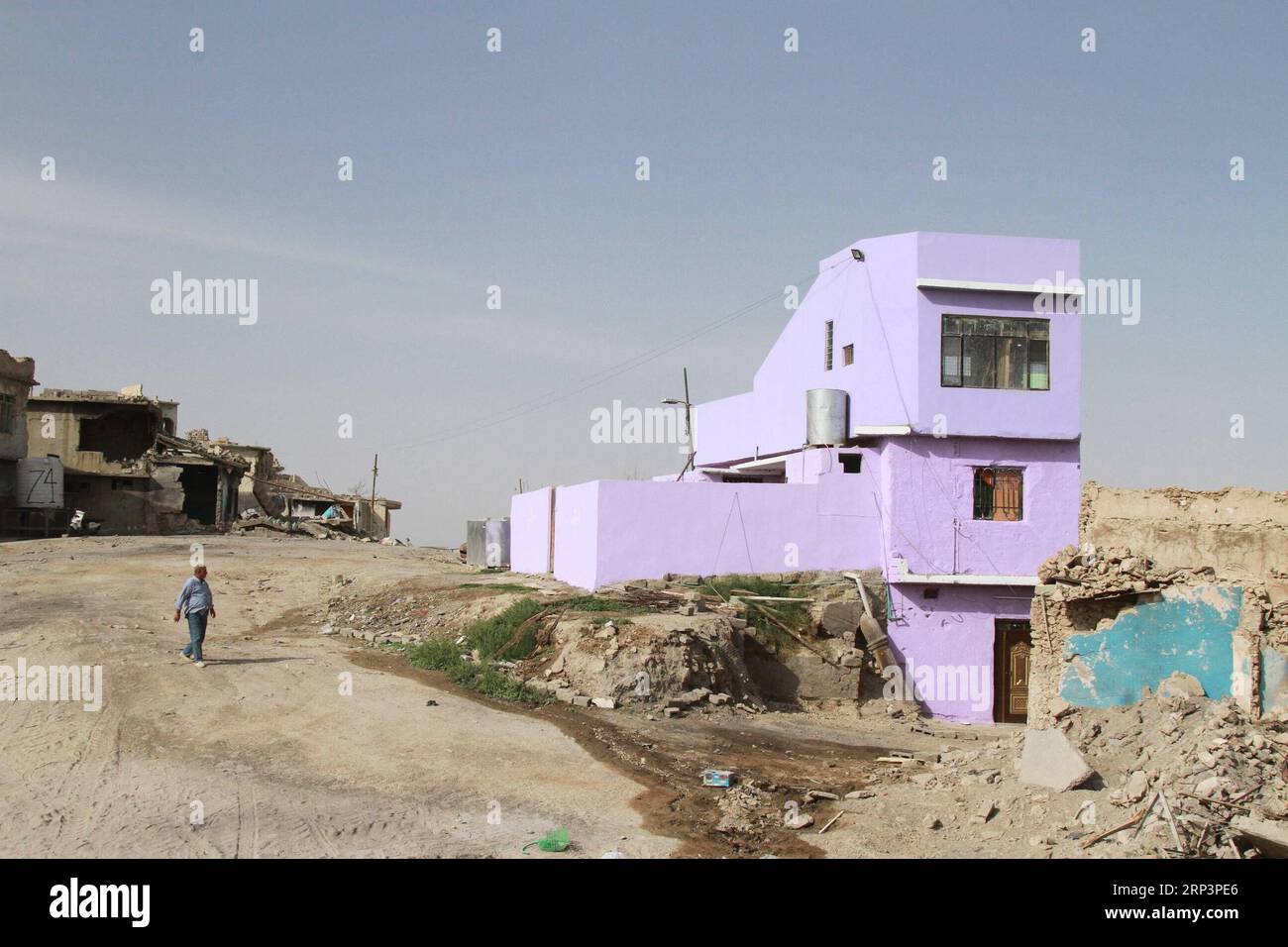 Man stands amid rubble hi-res stock photography and images - Alamy