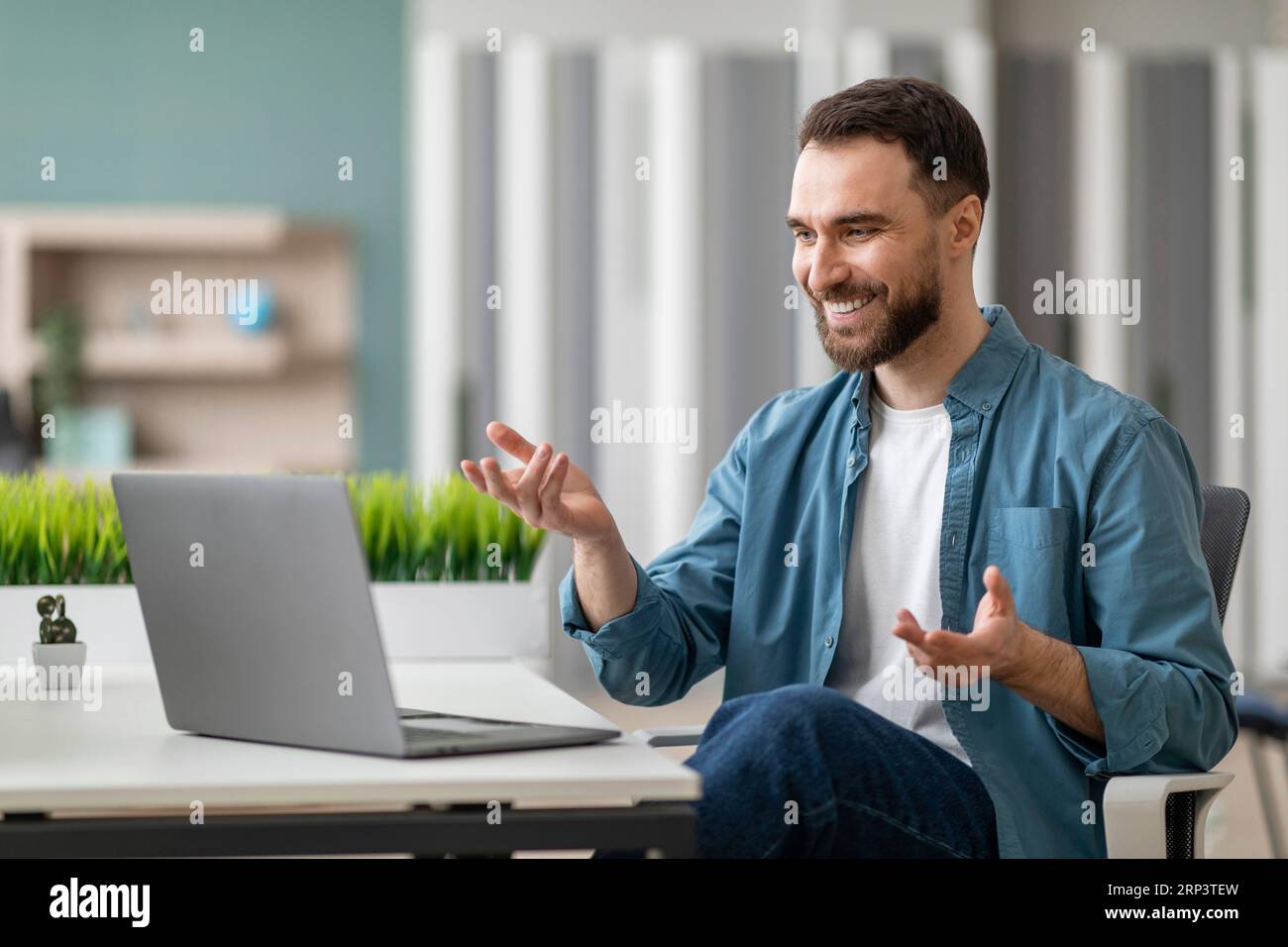 Video Conference. Smiling male office employee having web call on ...