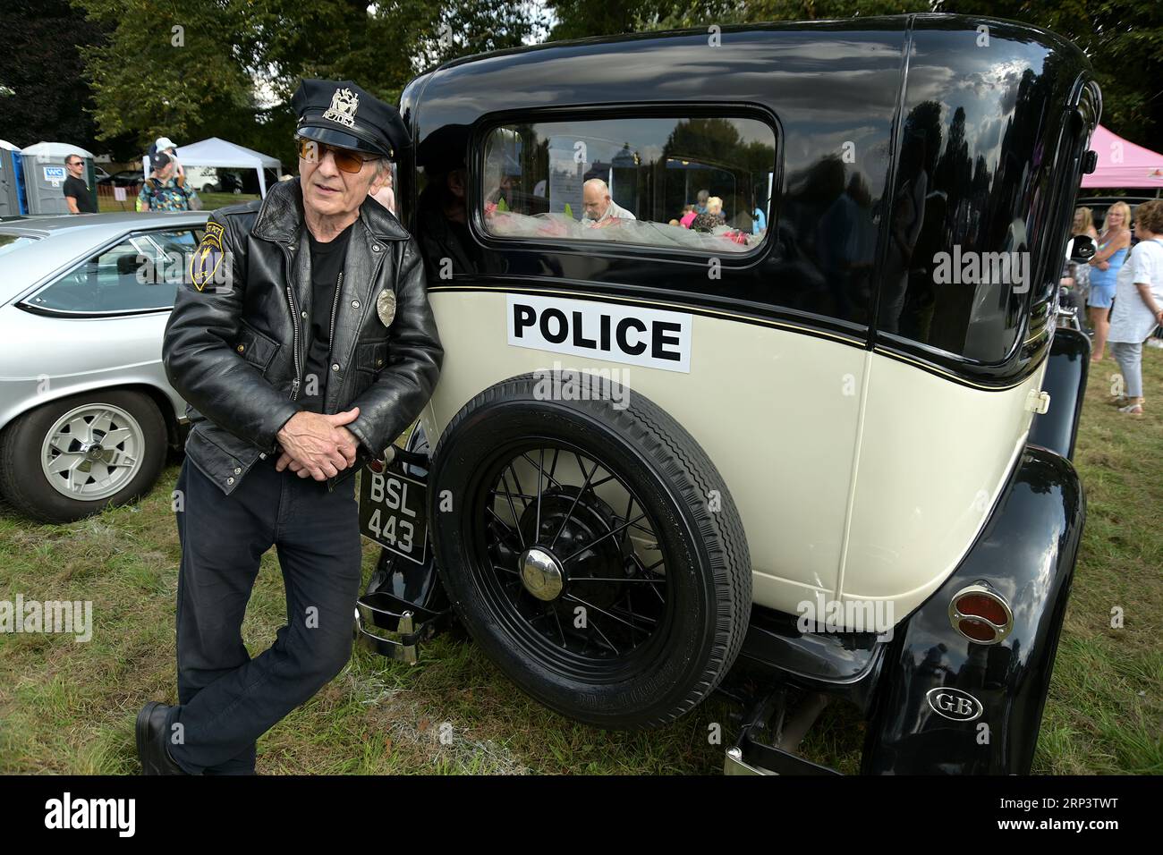 A New York cop with the 1930 Ford Model A Deluxe Town Sedan at Redbourn ...