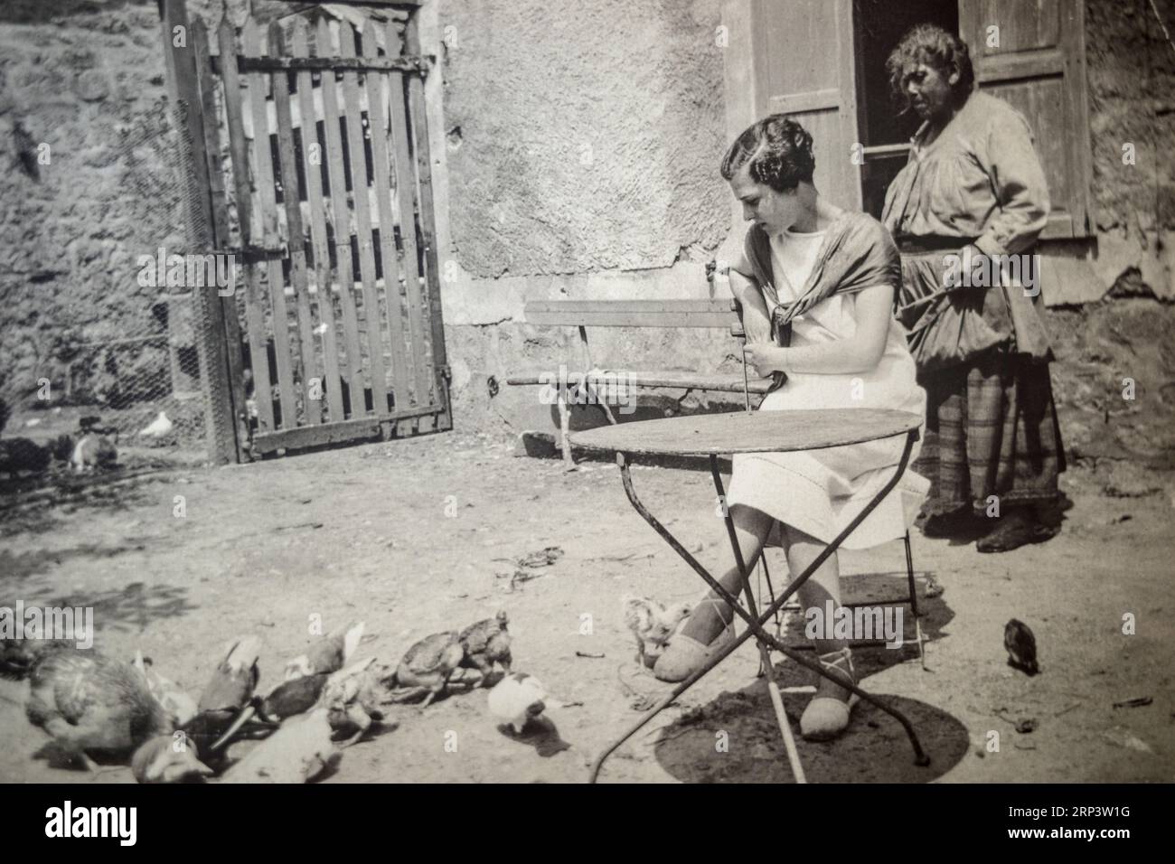 YOUNG WOMAN IN A FARM YARD DURING A VISIT IN THE COUNTRYSIDE - FRANCE ...