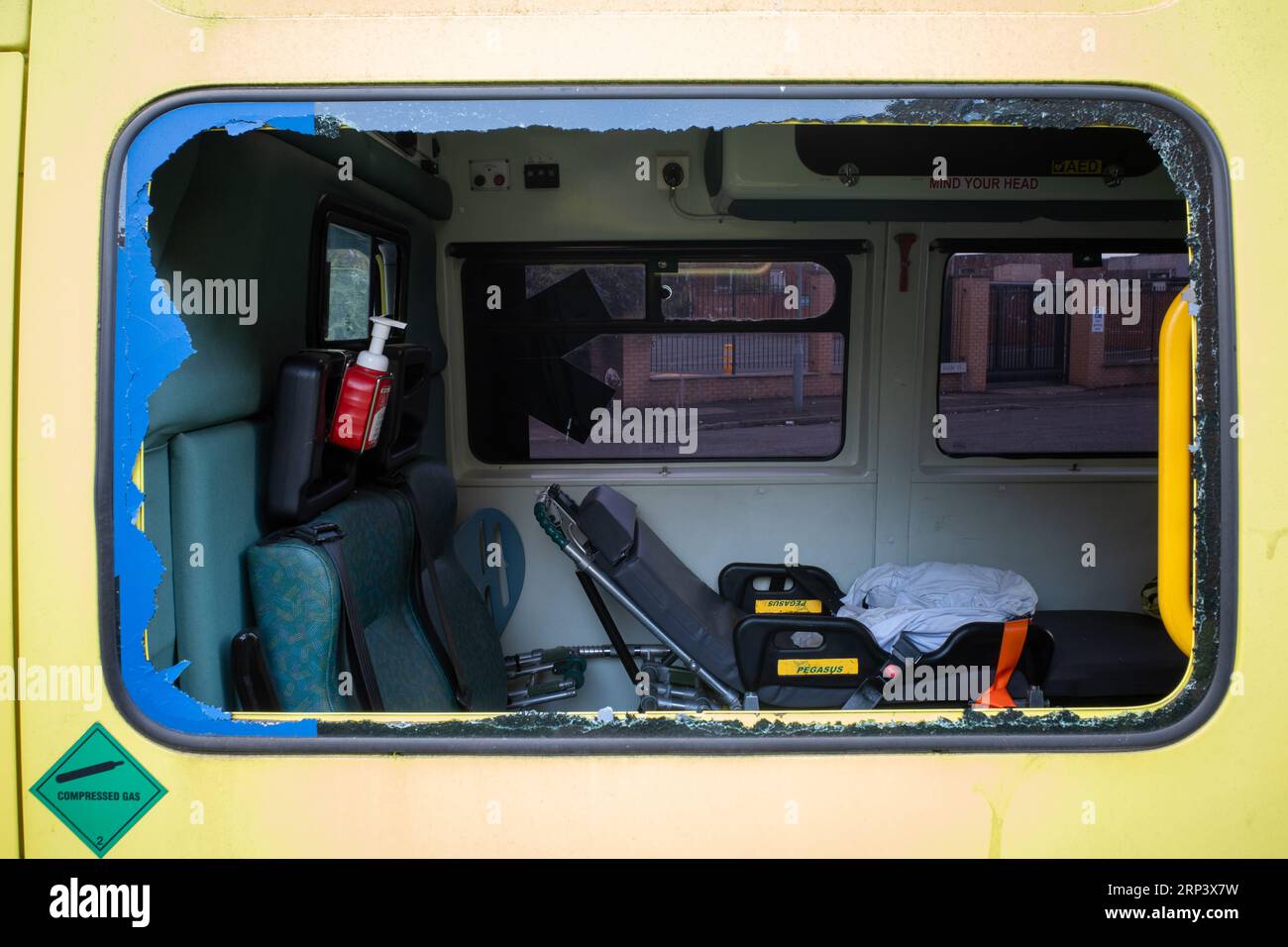 Ambulance with smashed window, in run down area, Birmingham, England ...