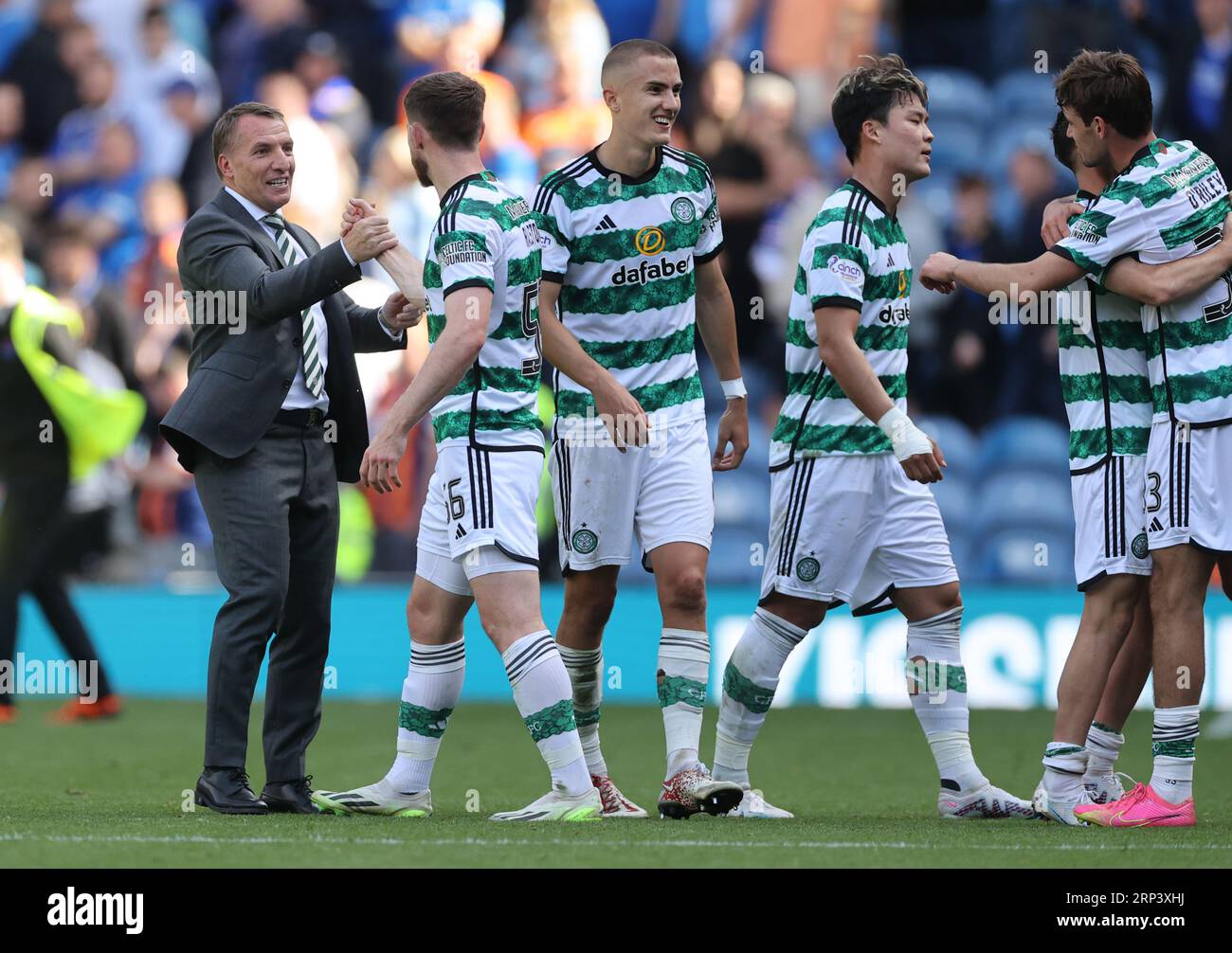 Celtic manager Brendan Rodgers (left) and Anthony Ralston following the ...