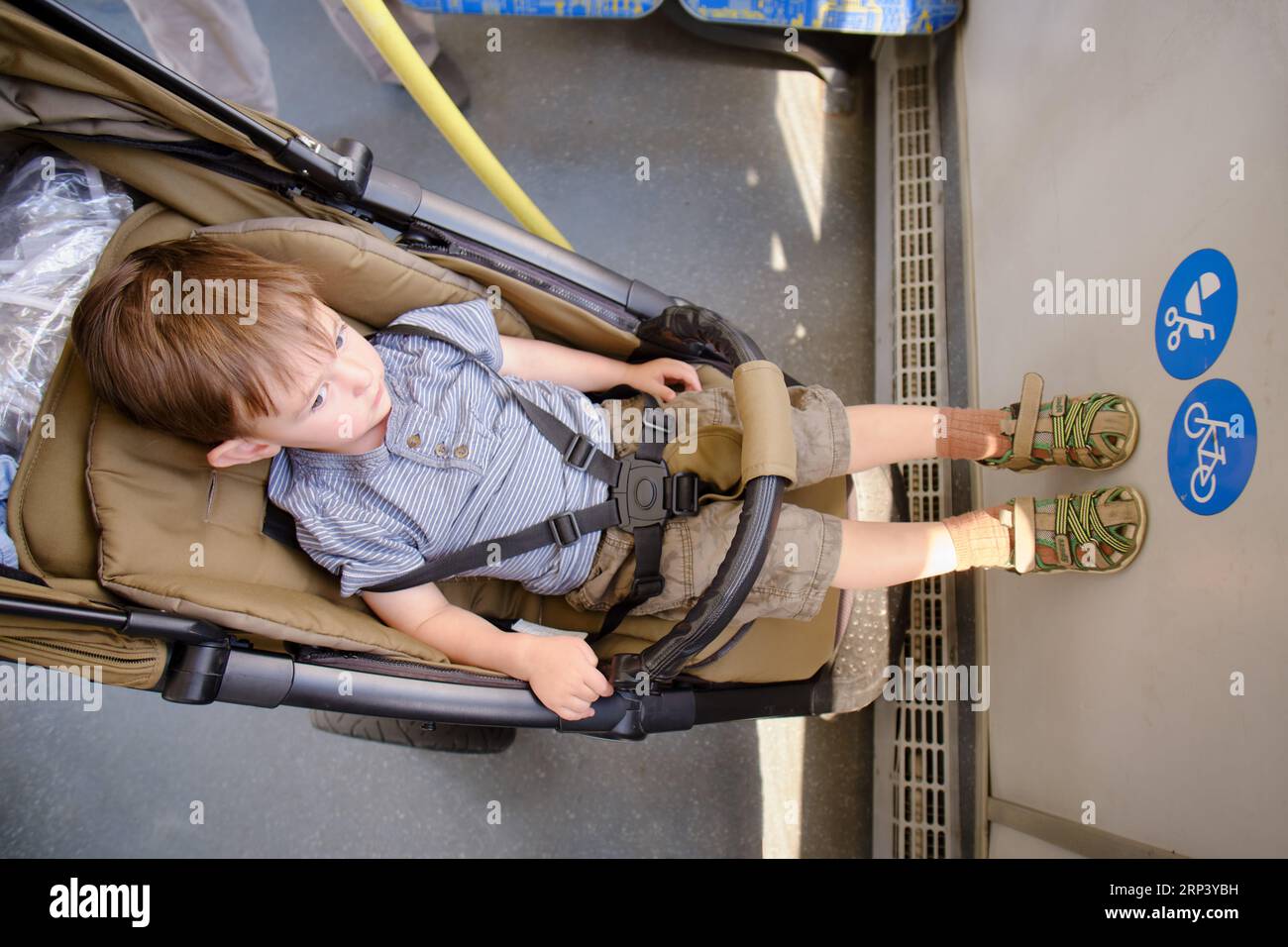 Child in buggy on bus hi-res stock photography and images - Alamy