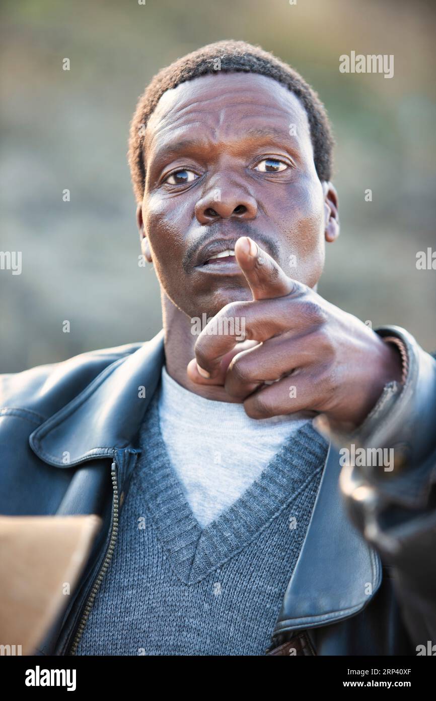 Outdoor portrait african man pointing hi-res stock photography and ...