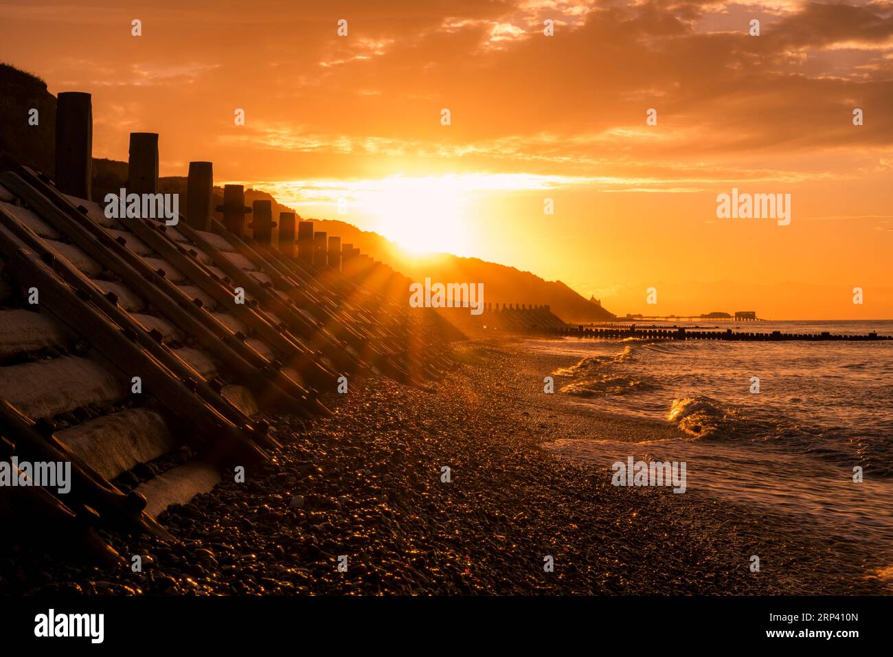 Looking along the sea defences at Overstrand with Cromer pier in the ...