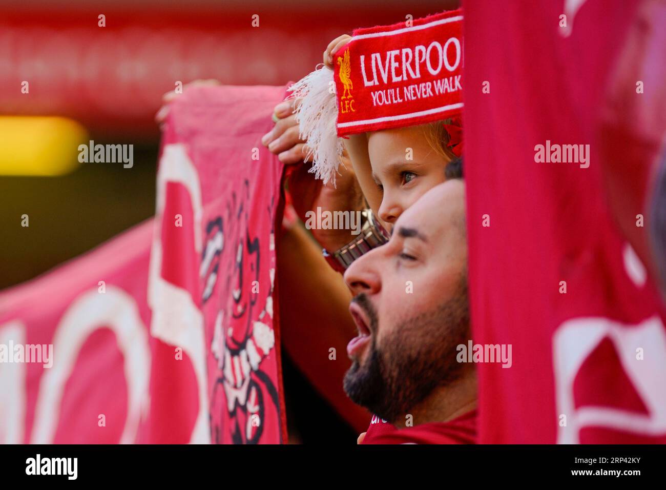 Liverpool fans cheer during the English Premier League soccer match ...