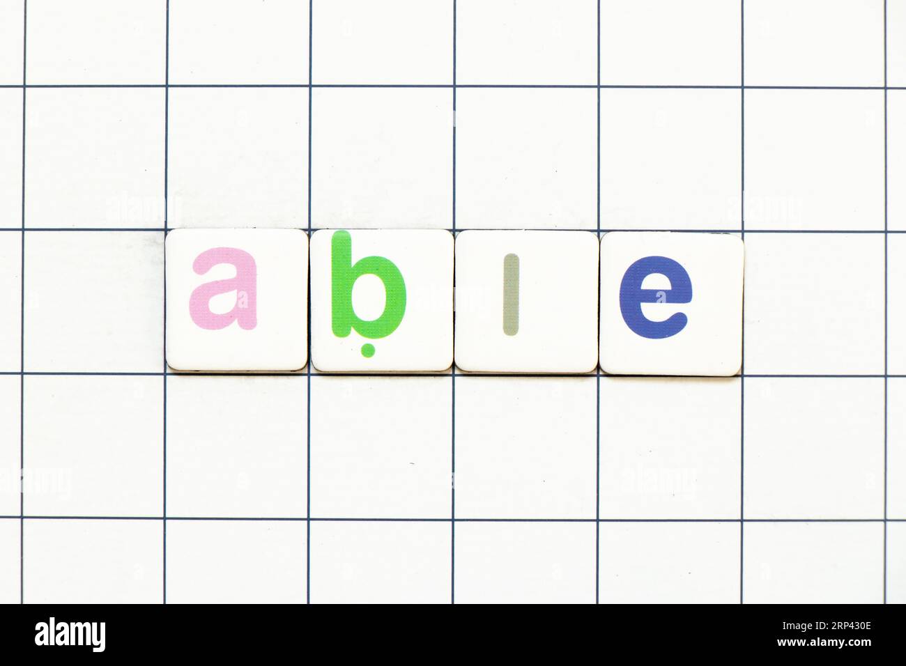 Colorful tile letter in word able on white grid background Stock Photo ...
