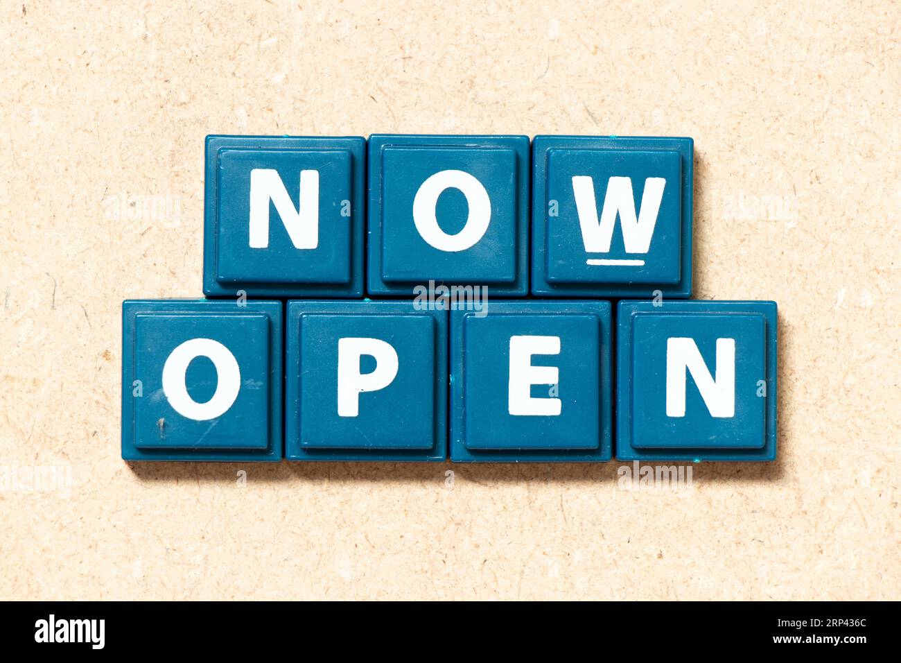 Tile alphabet letter in word now open on wood background Stock Photo ...