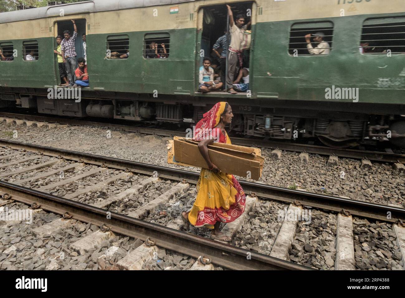 Woman walks along railway tracks hi-res stock photography and images ...