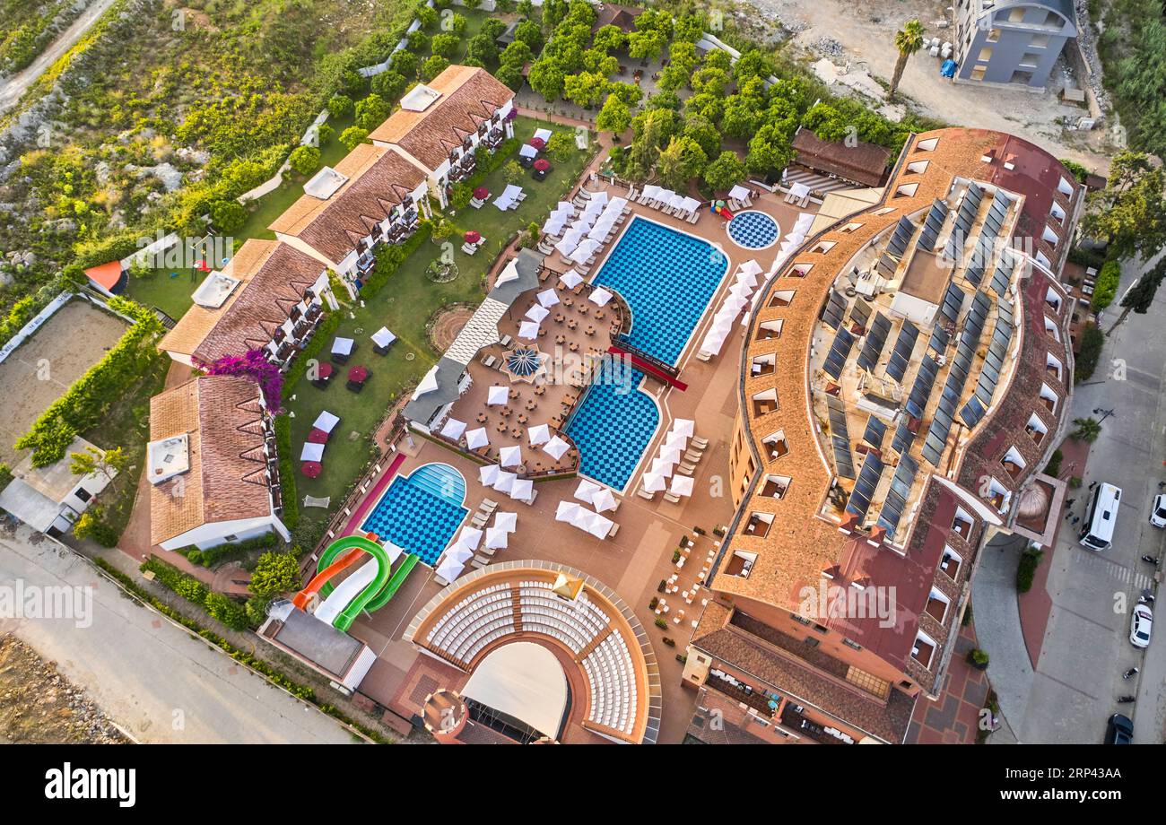 beautiful drone shot of a hotel's pool and water slides. water park of ...
