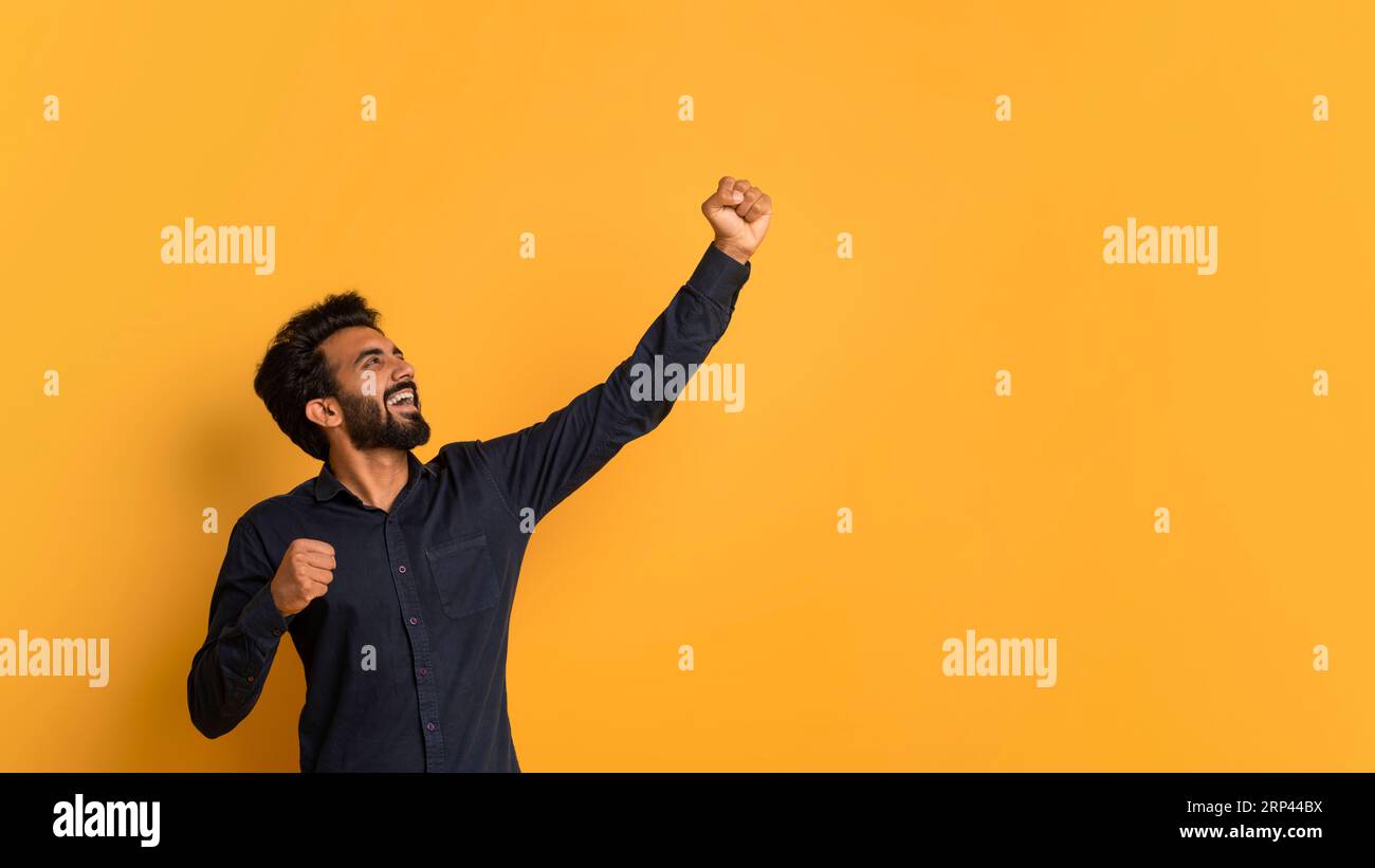 Hooray Concept. Overjoyed Young Indian Man Celebrating Success With ...