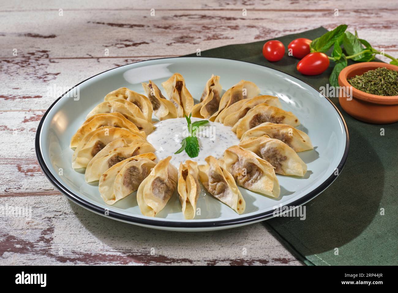 Traditional Turkish food and Ravioli, Manti, on a beautiful background ...