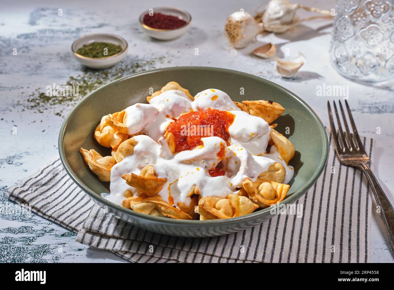 Traditional Turkish food and Ravioli, Manti, on a beautiful background ...