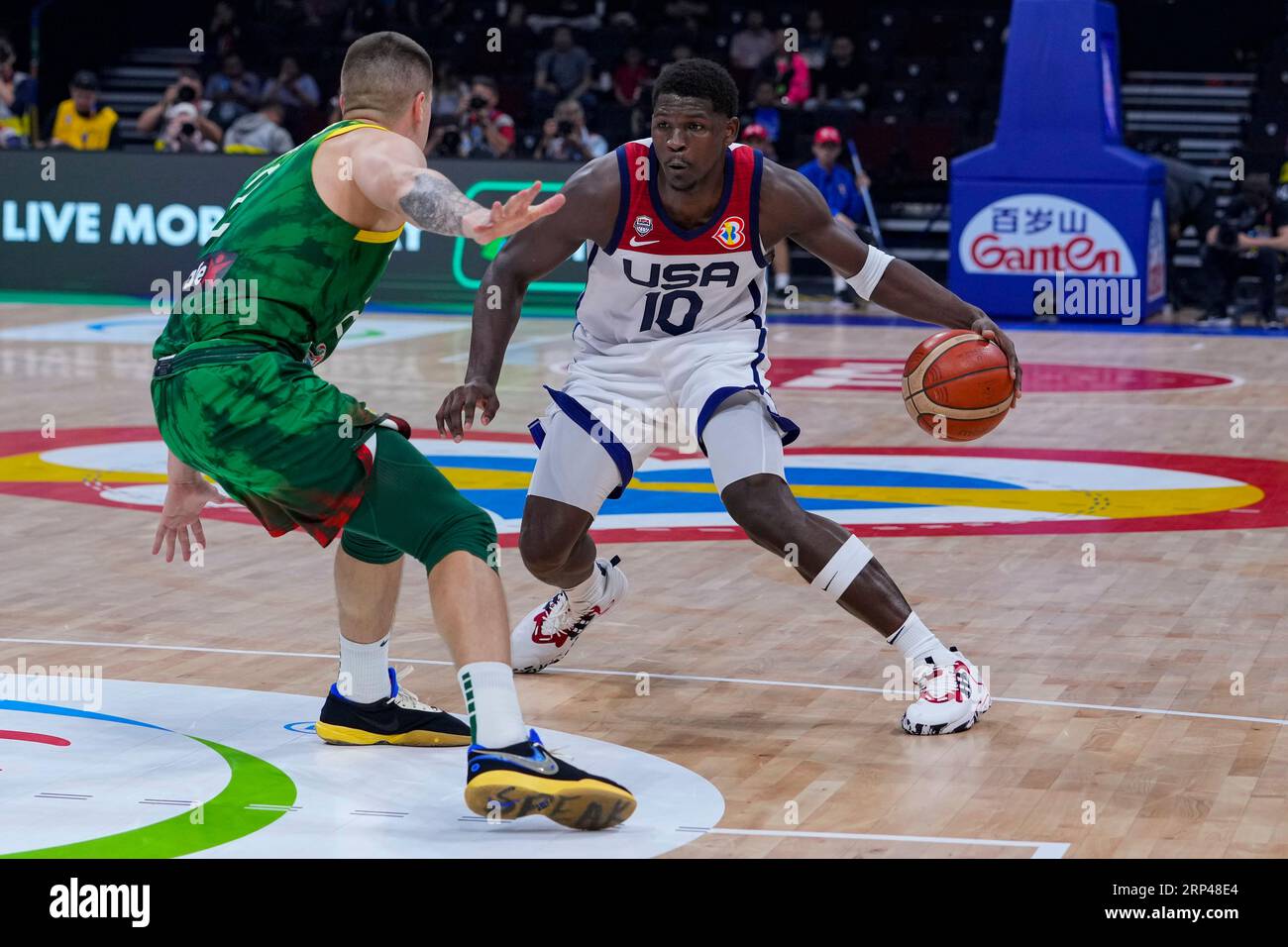 U.S. guard Anthony Edwards (10) drives on Lithuania guard Margiris ...