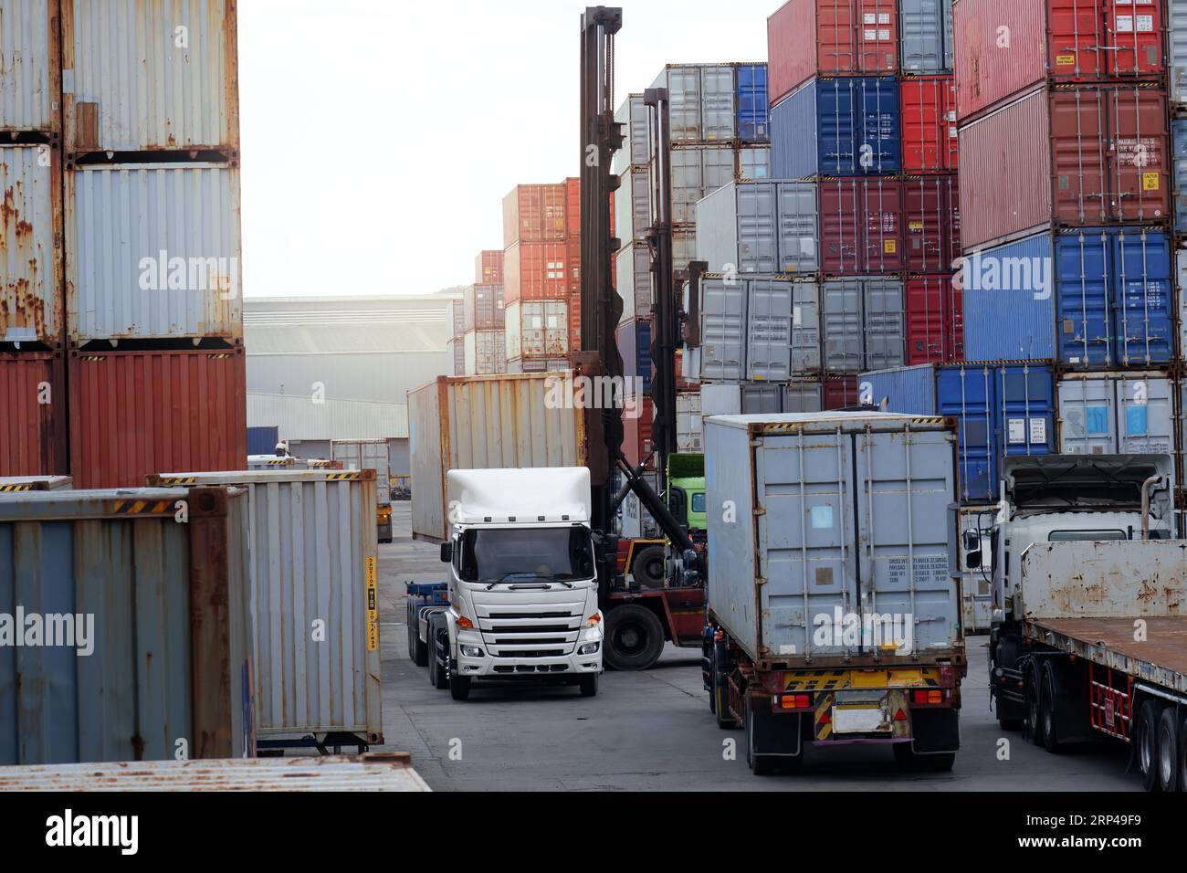 Container forklift truck and container yard view Stock Photo - Alamy