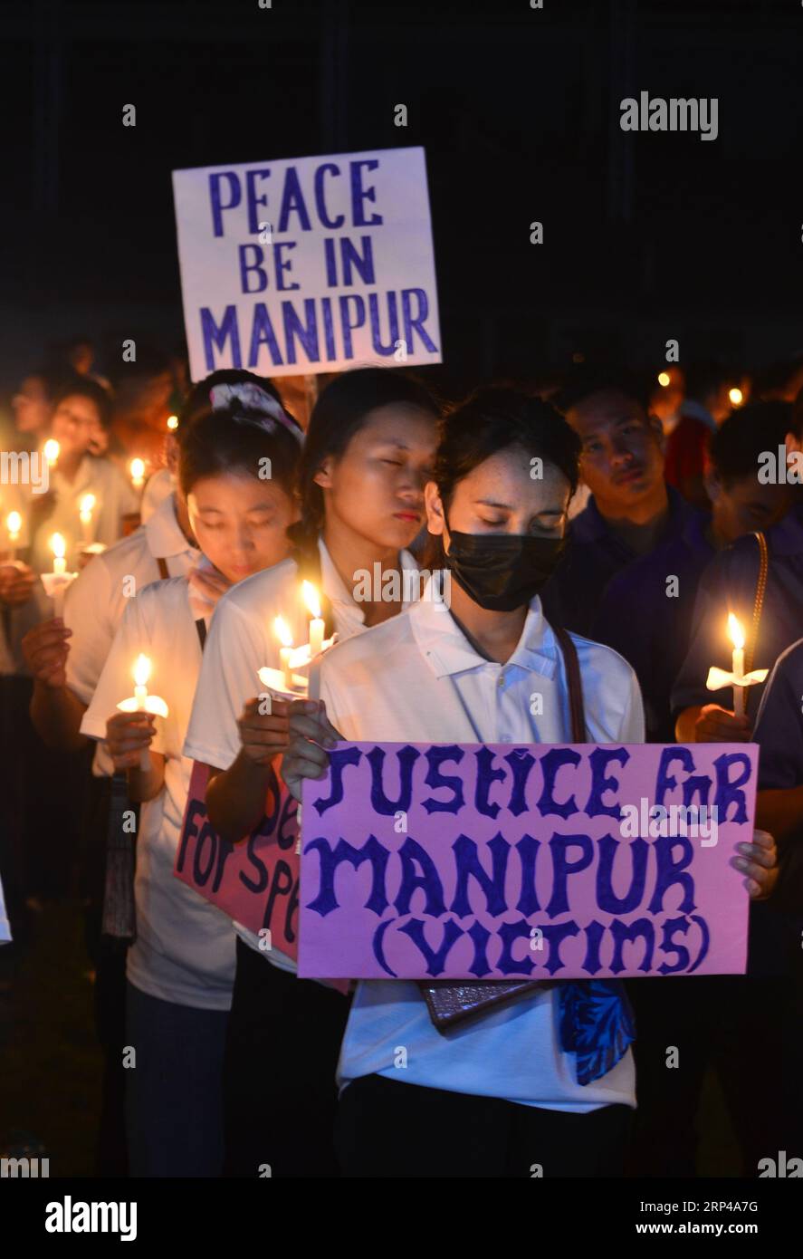 Dimapur, India. 3rd Sep, 2023. Peoples holding placard and light candle ...