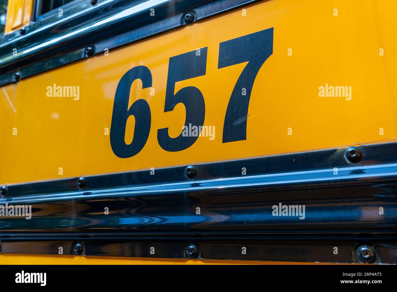 Front of a parked yellow school bus number 657 Stock Photo - Alamy