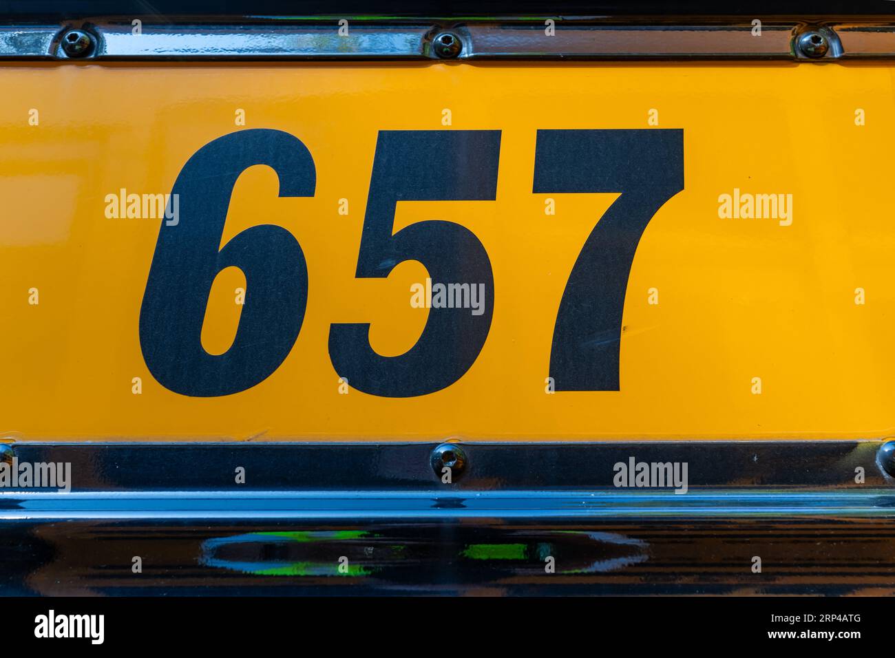 Front of a parked yellow school bus number 657 Stock Photo - Alamy