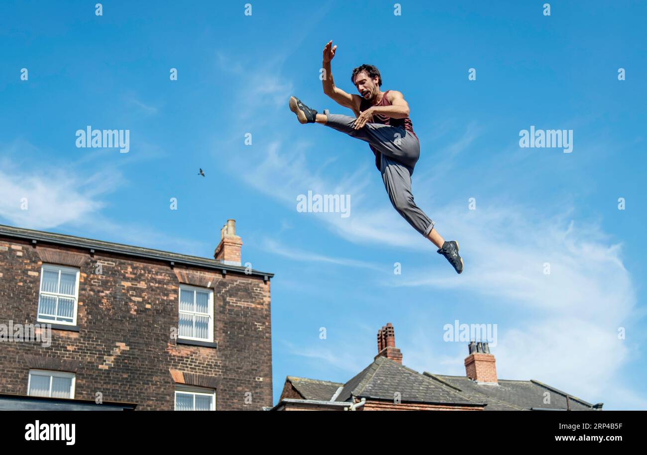 An acrobat from contemporary circus Tripotes la Compagnie during a ...