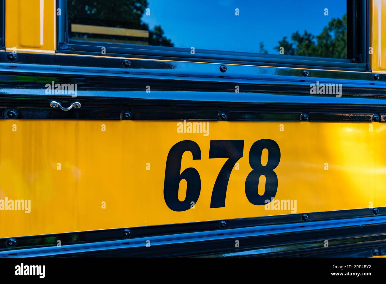Side of a parked yellow school bus number 678 Stock Photo - Alamy