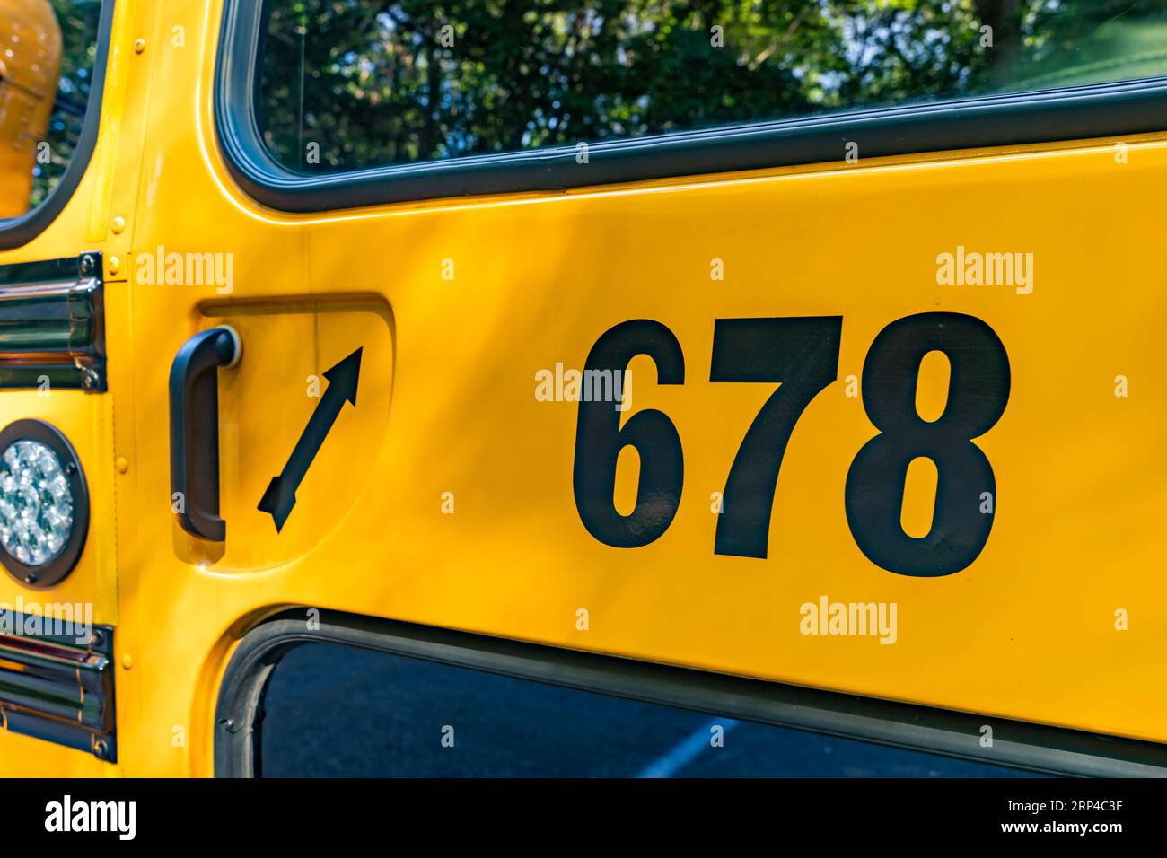 Side of a parked yellow school bus number 678 Stock Photo - Alamy