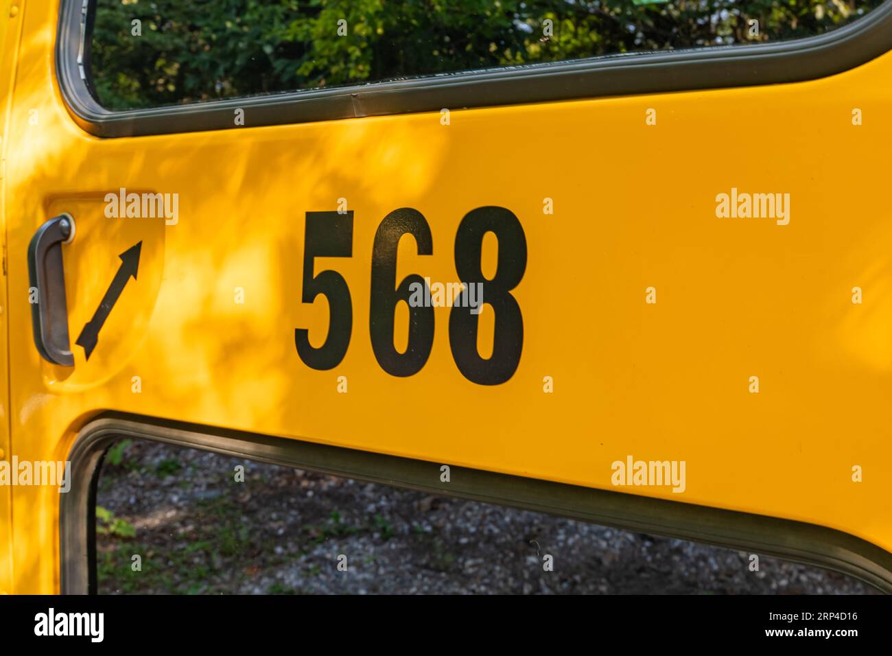 Back of a parked yellow school bus number 568 Stock Photo - Alamy