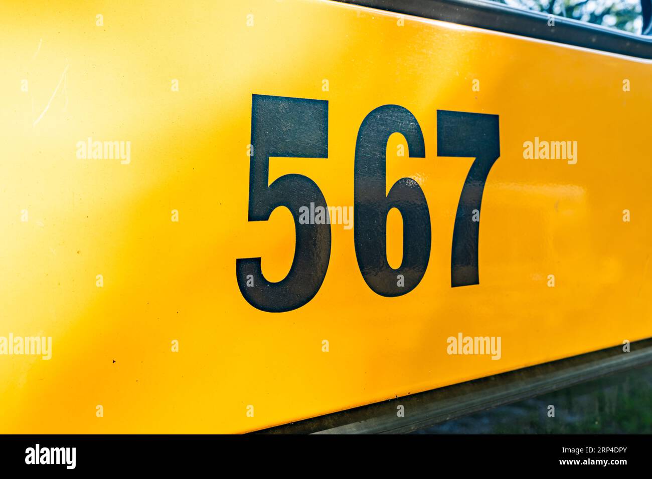 rear of a parked yellow school bus number 667 Stock Photo - Alamy